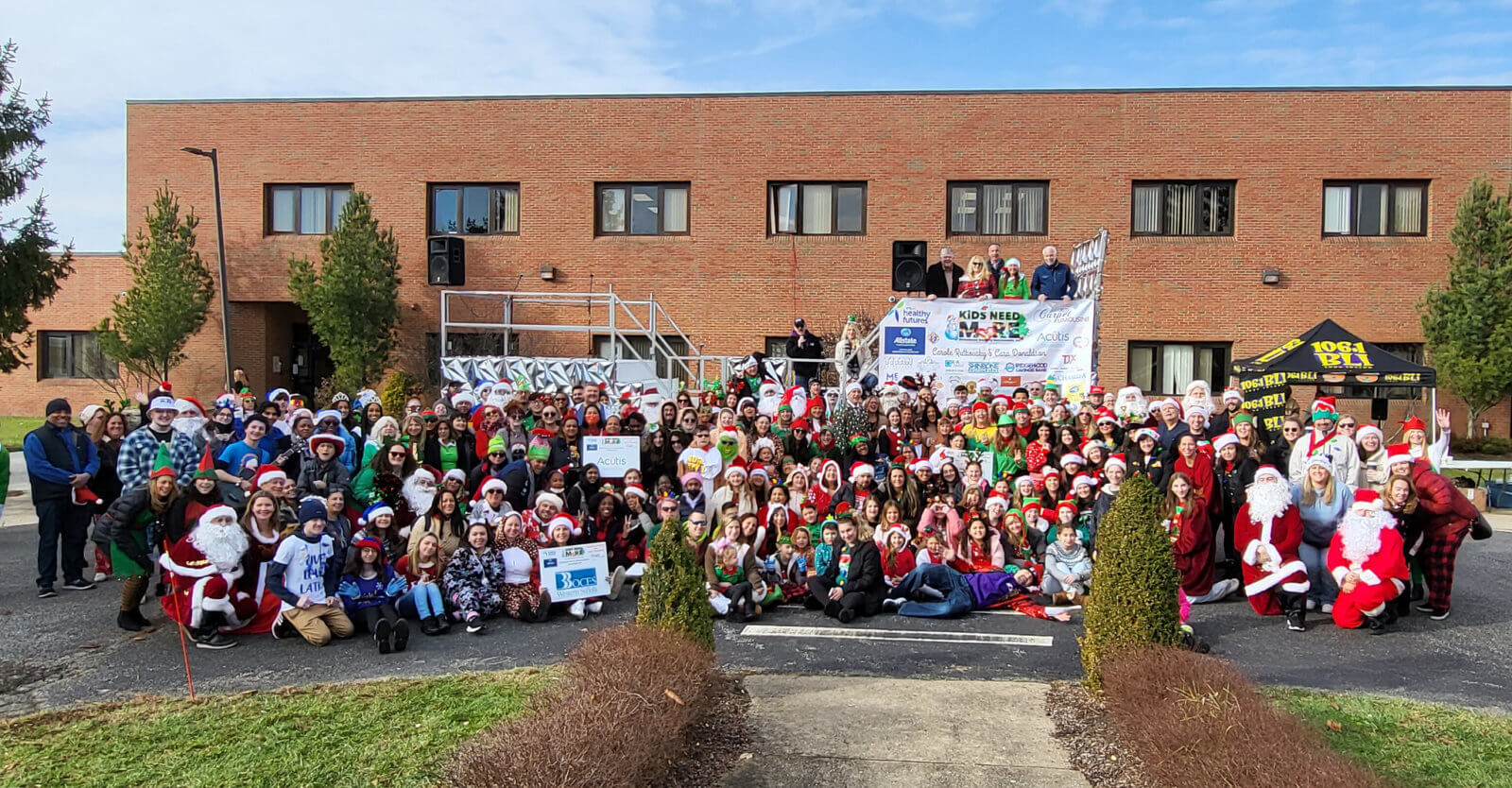 The 8th Annual Kids Need More Holiday Cheer Bus Elf Ride