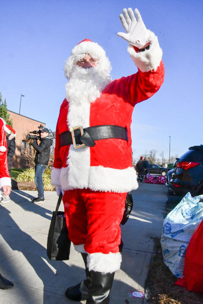 The 8th Annual Kids Need More Holiday Cheer Bus Elf Ride