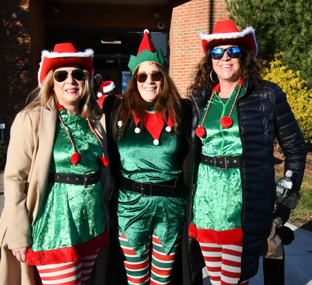 The 8th Annual Kids Need More Holiday Cheer Bus Elf Ride