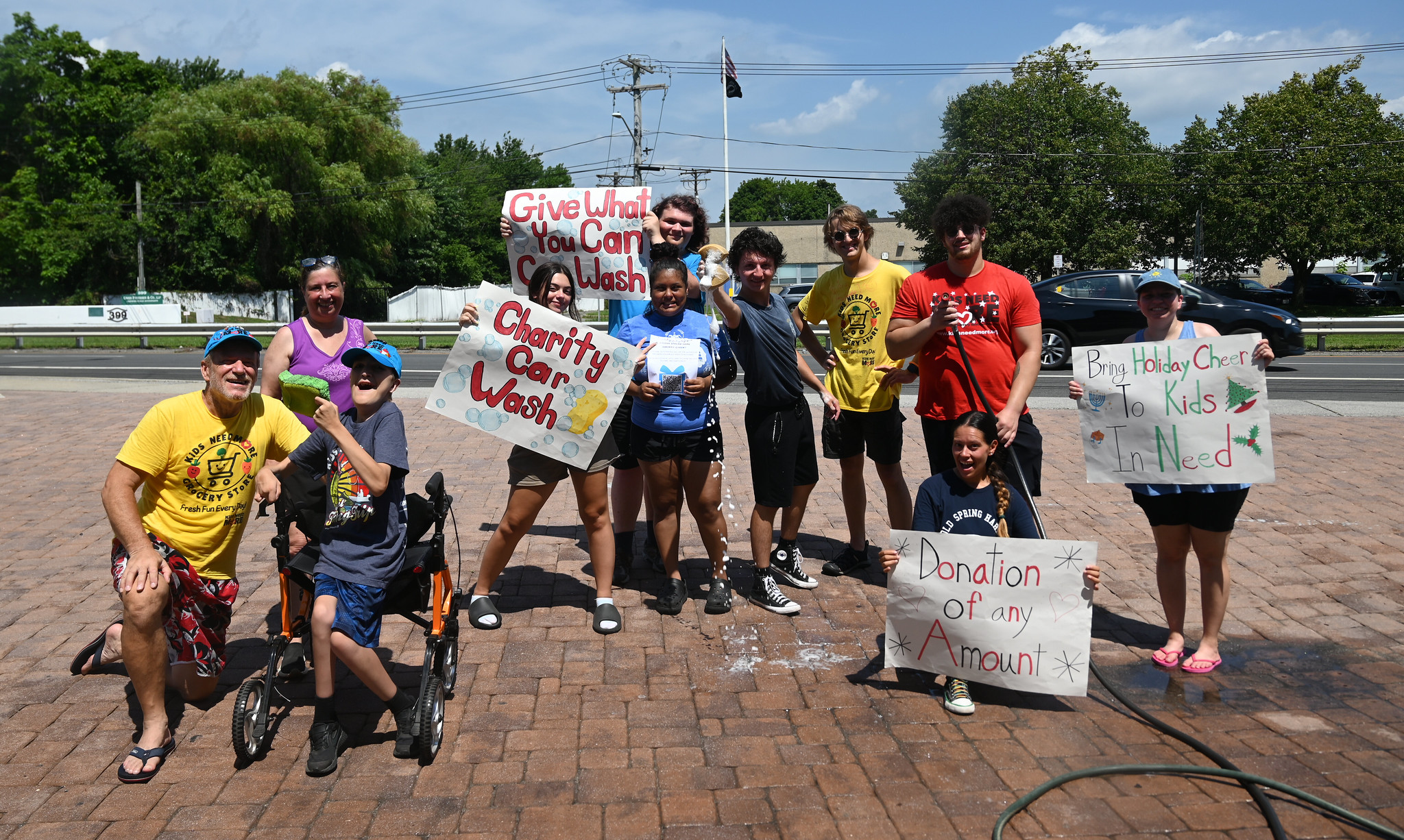Hassell Auto Body hosts Kids Need More Car Wash Fundraiser