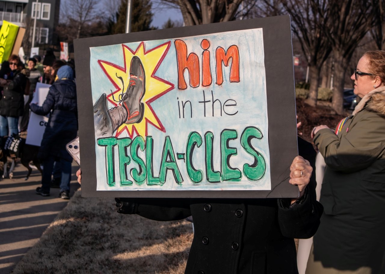 Anti-Elon Musk protest at Westbury Tesla dealership part of ...